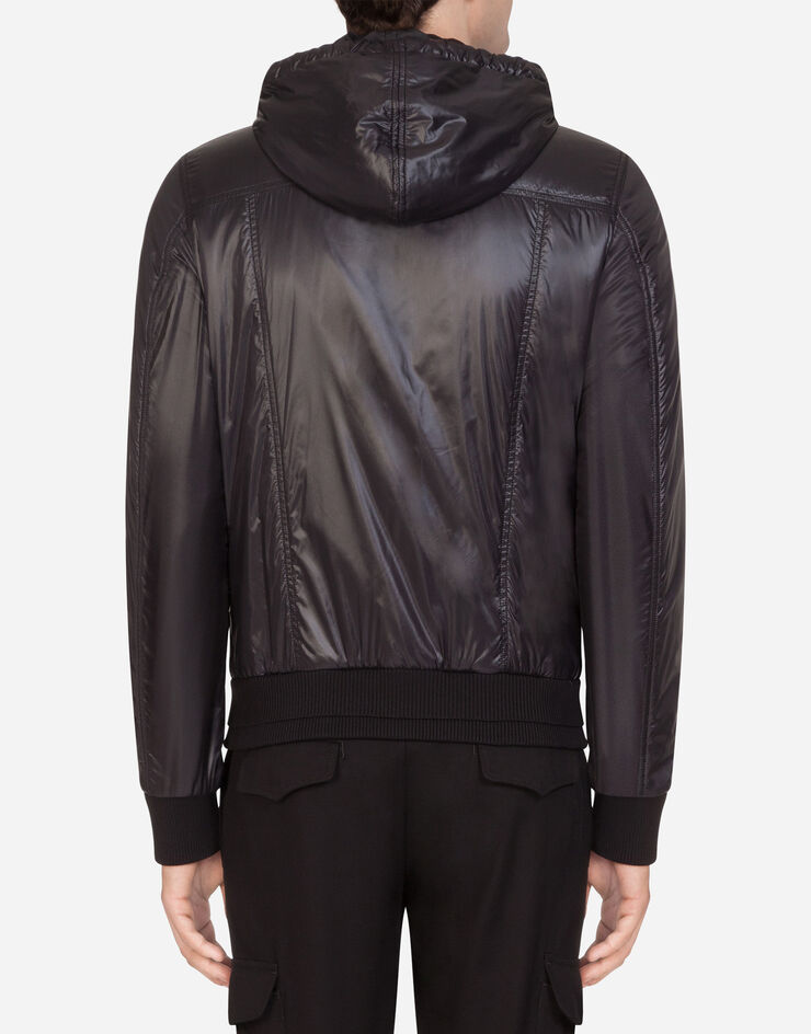 Nylon quilted jacket with hood and patch