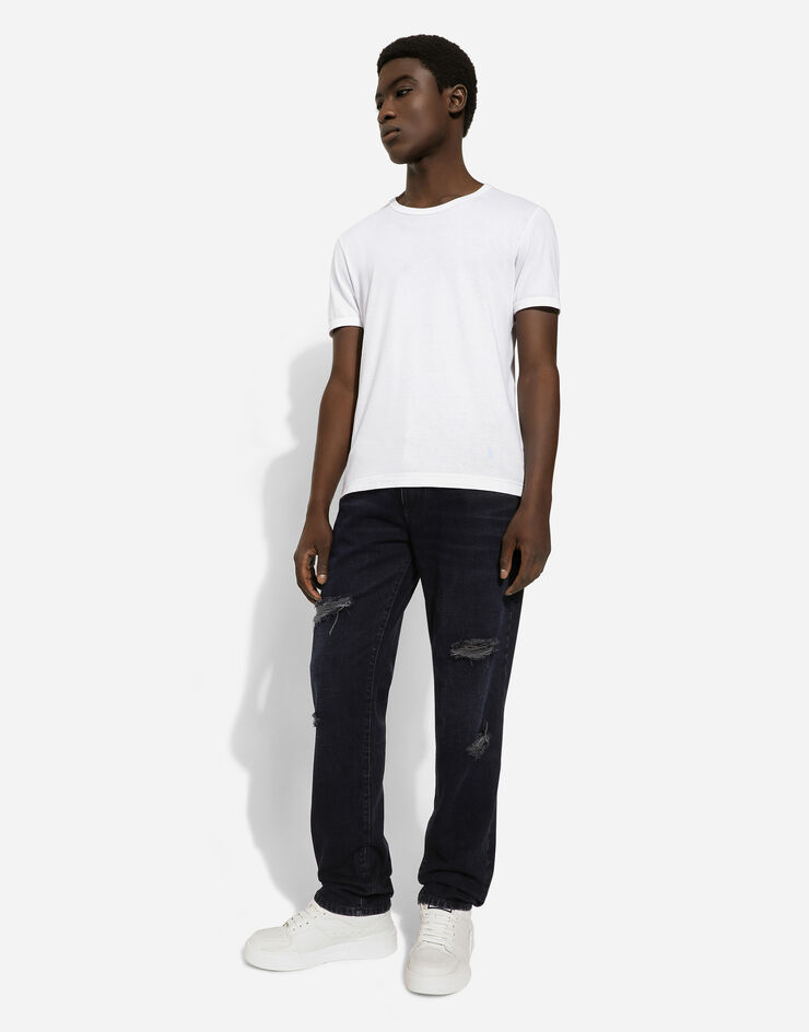 Regular blue denim jeans with abrasions and rips in Blue for Men | Dolce&Gabbana®