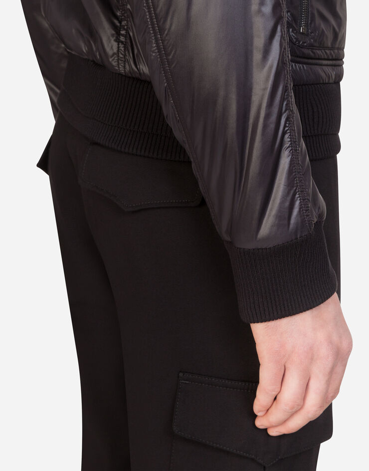 Nylon quilted jacket with hood and patch