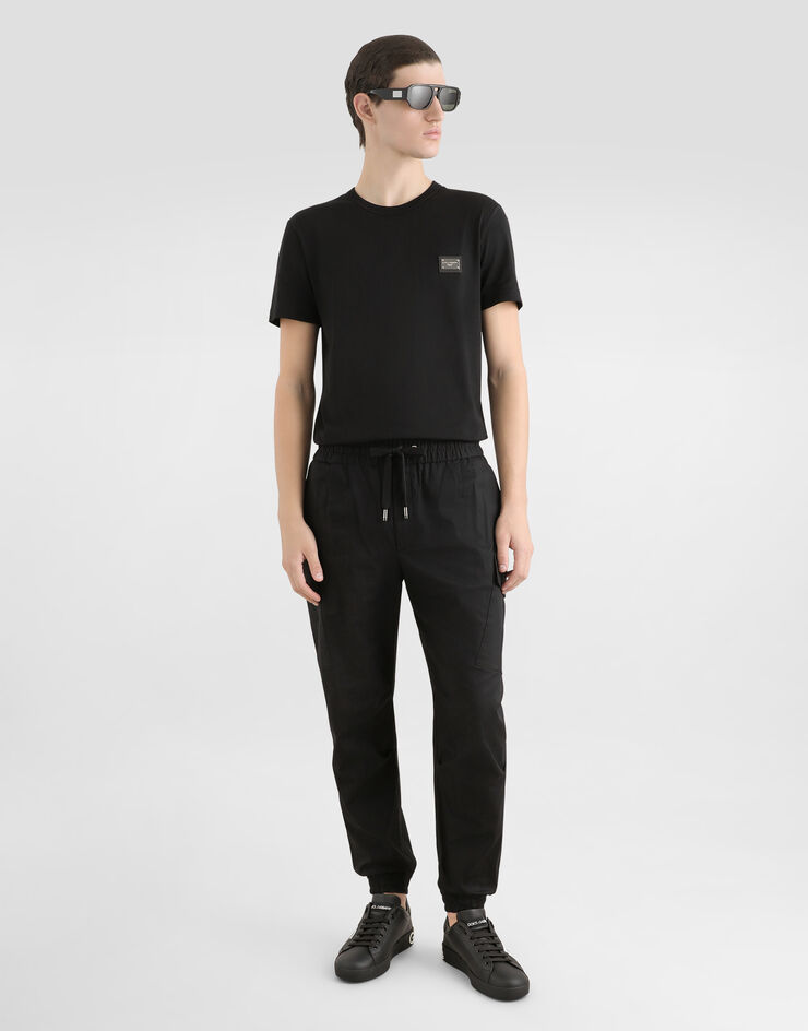 Cotton cargo pants with branded tag in Black for Men | Dolce&Gabbana®