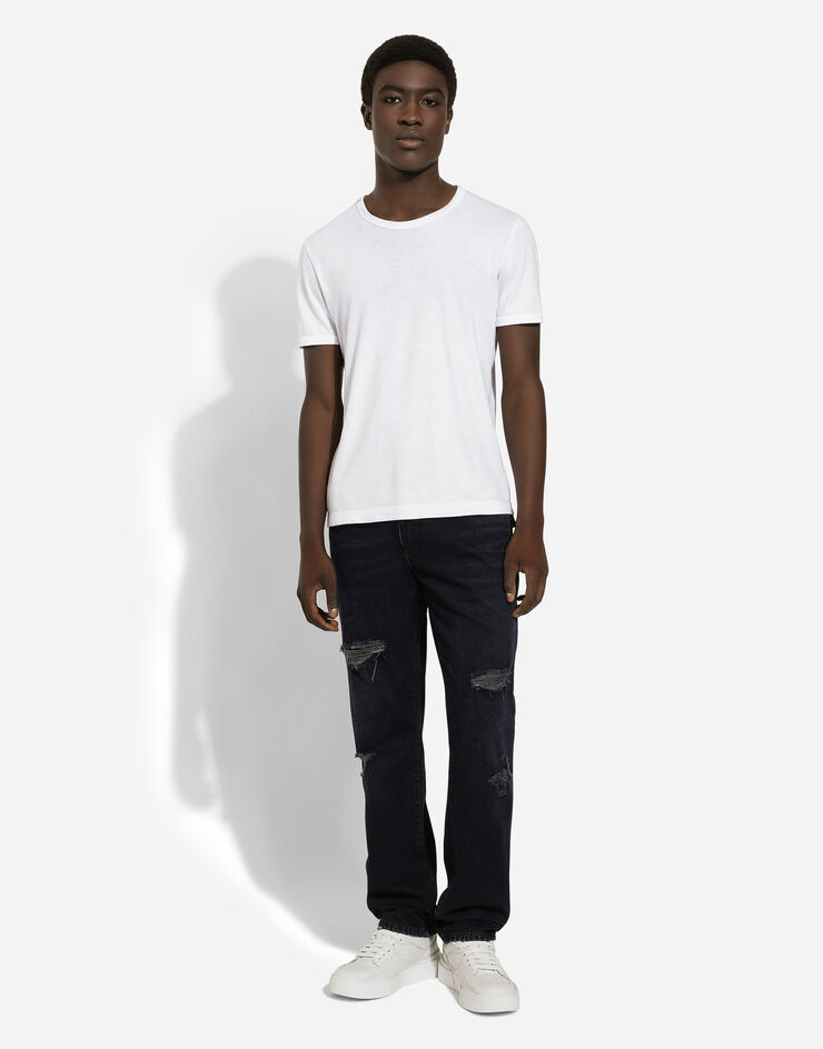 Regular blue denim jeans with abrasions and rips in Blue for Men | Dolce&Gabbana®