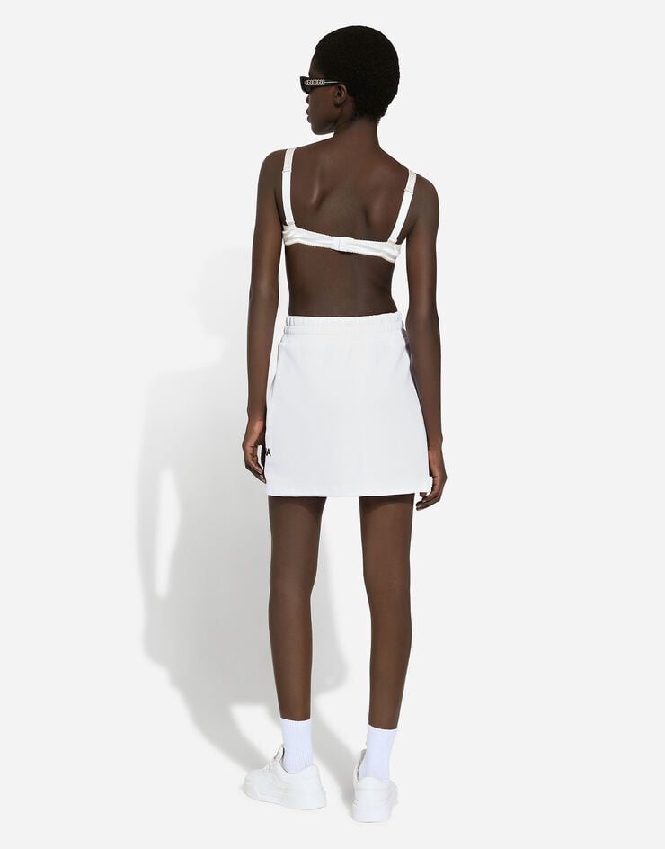 Jersey Miniskirt With Dg Logo Patch In White For Dolceandgabbana® Us