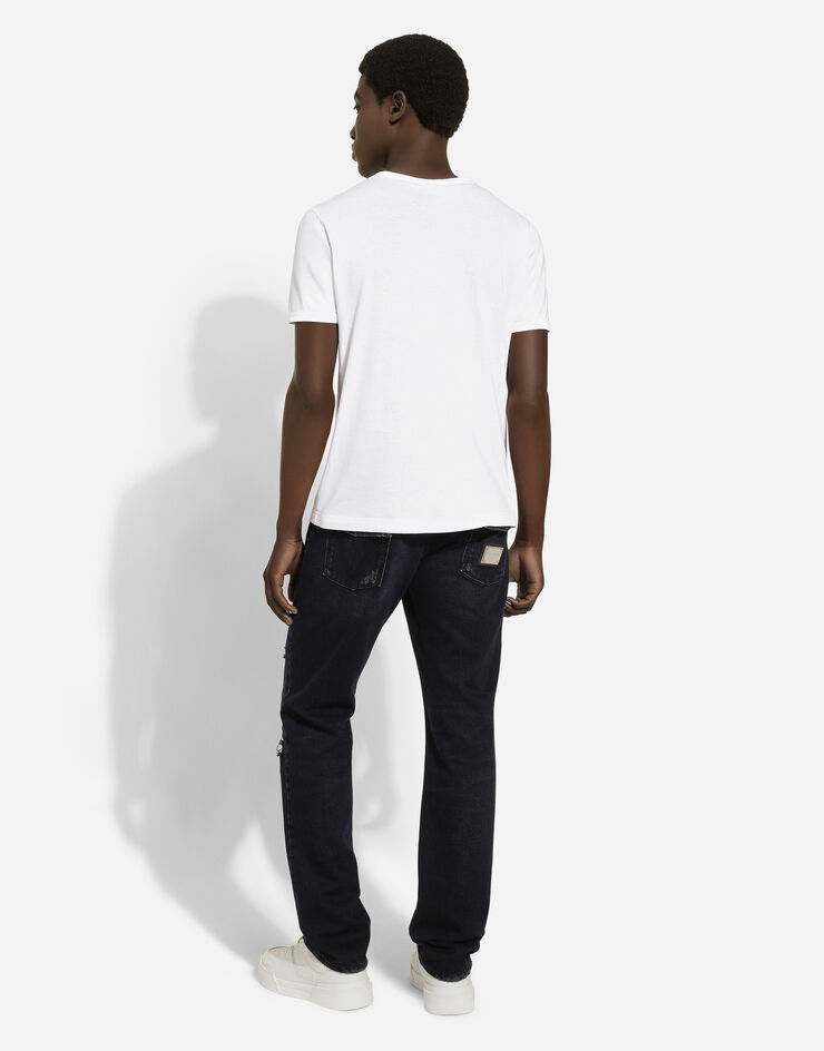 Regular blue denim jeans with abrasions and rips in Blue for Men | Dolce&Gabbana®